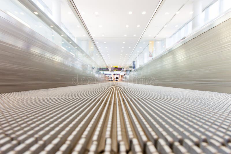 Moving airport slidewalk stock image. Image of speedwalk - 65611183