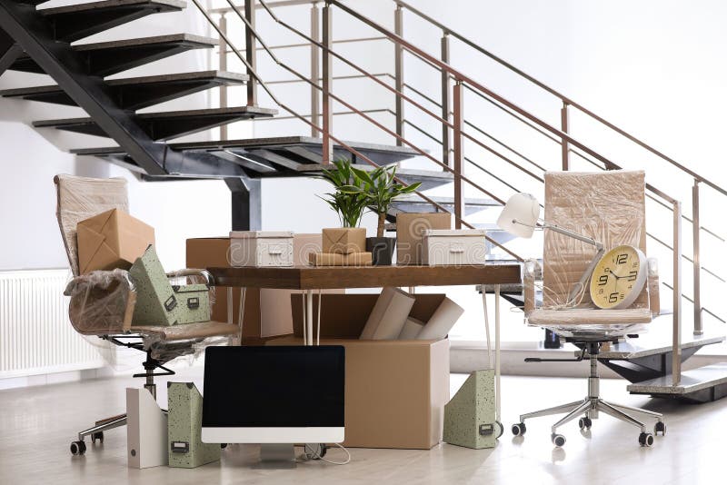Moving Boxes and Furniture in Office Stock Photo - Image of relocation ...