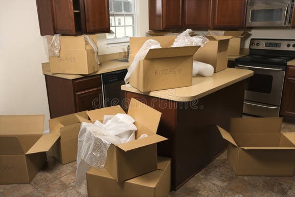 Moving boxes in kitchen. stock image. Image of photograph - 2043835