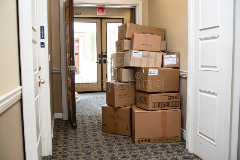 Moving Boxes Piled in Doorway â€ Relocation Concept Image Stock ...