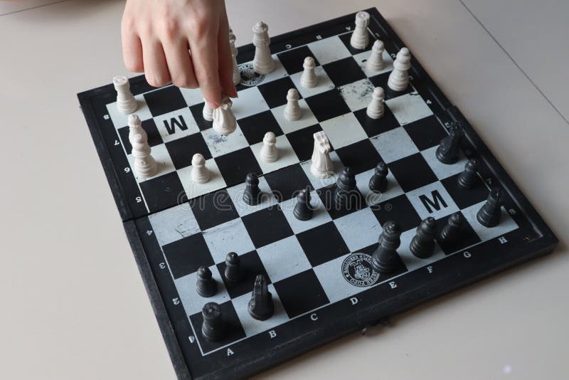 Moving a Chess Piece while Playing a Chess Game at Home Stock Photo ...