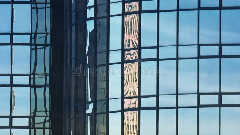 Moving Clouds Reflecting in the Windows of a Glass Skyscraper Stock ...