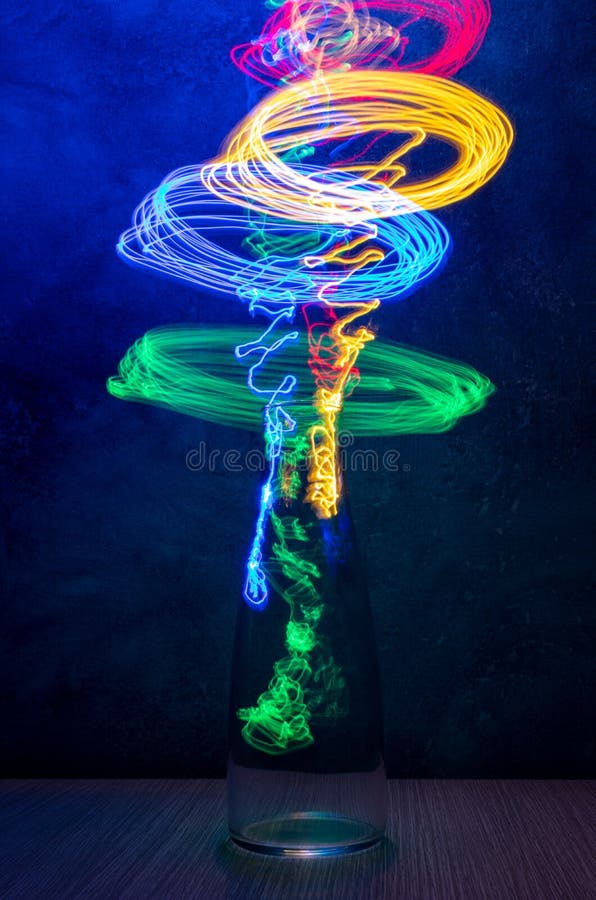 Moving Colorful Neon Light in a Glass Bottle Stock Photo - Image of ...
