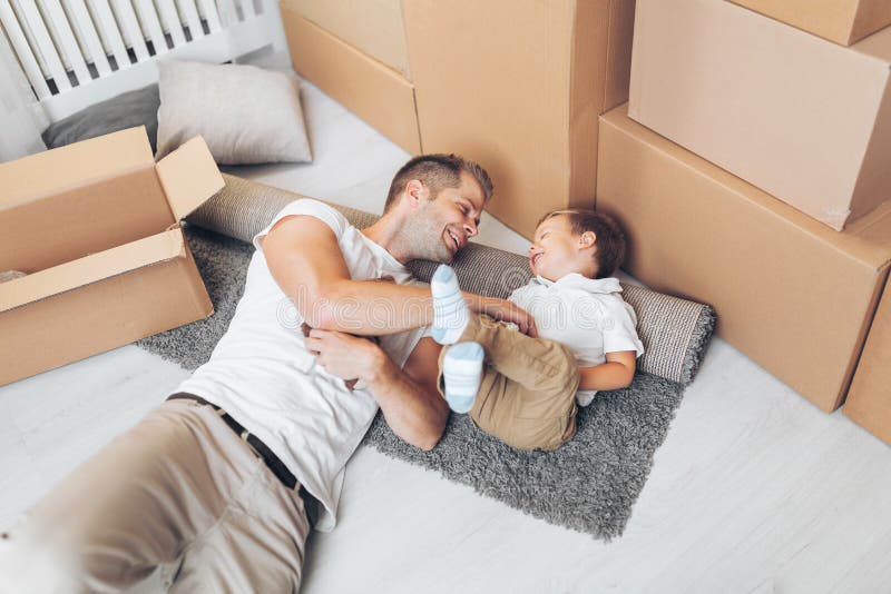 Moving Concept, Father and Son Moving To a New Home Stock Image - Image ...
