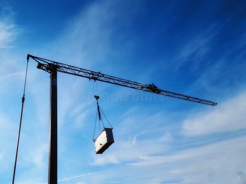 Moving Crane with Hooked Construction Material Stock Photo - Image of ...