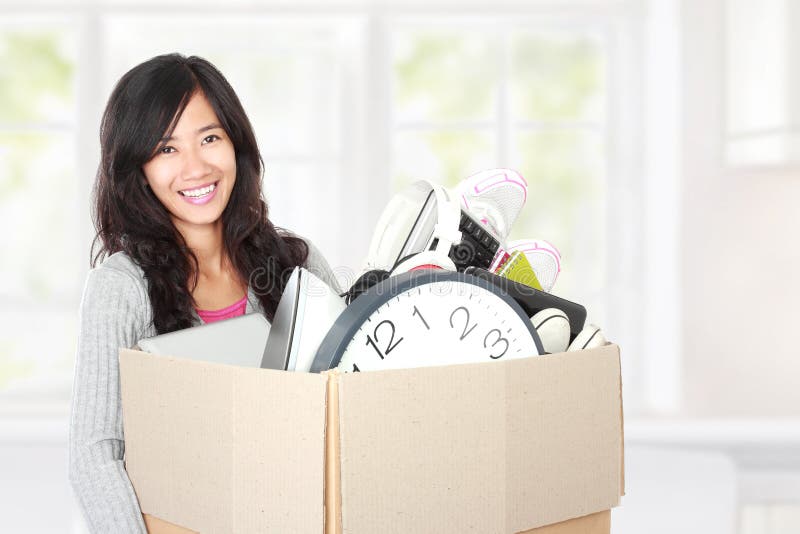 Moving Day. Woman with Her Stuff Inside the Cardboard Box Stock Photo ...