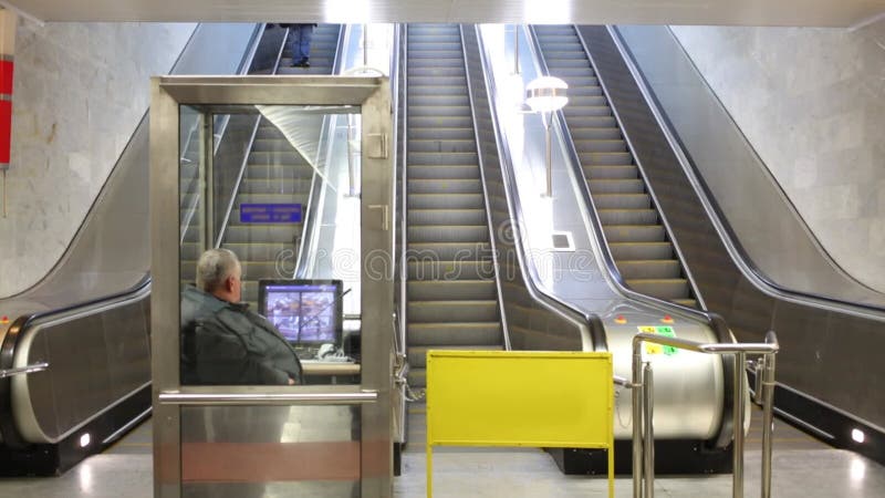 Moving Escalator in Metro Level and Security Guard Stock Video - Video ...
