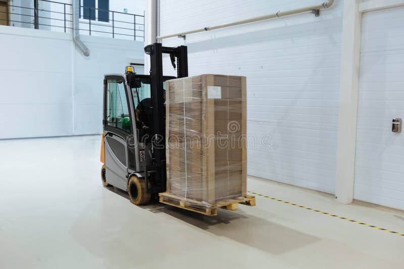 Moving Forklift Loader in Modern Warehouse, Motion Blur Stock Photo ...