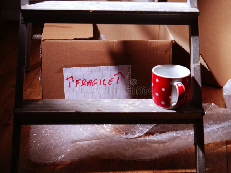 Moving Fragile Items with Cardboard Boxes and Bubble Wrap Stock Photo ...