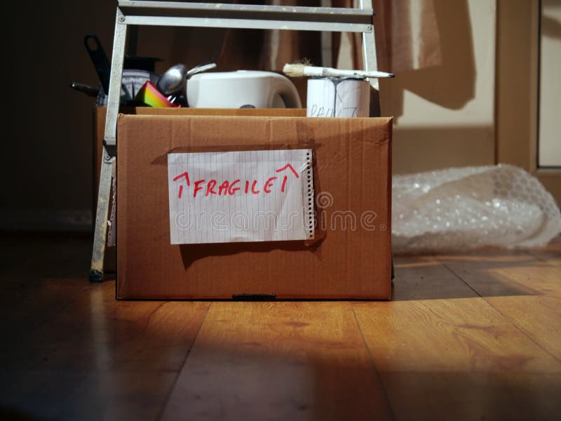 Moving Home with Fragile Kitchen Items in a Box Stock Photo - Image of ...