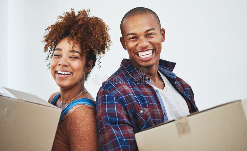 Moving Out and Moving Up. an Attractive Young Couple Moving House ...