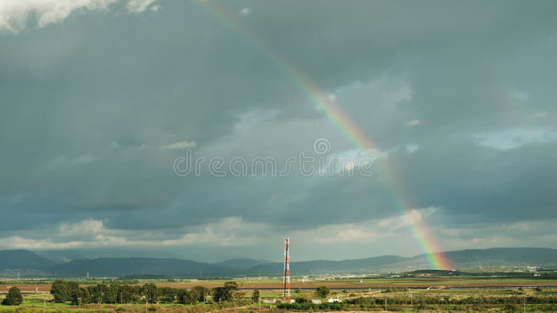 Moving Rainbow Over the Fields of Galilee, Israel with Sun Rays Stock ...
