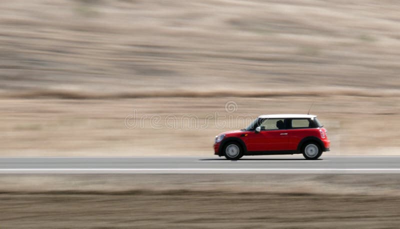 Speeding car (Mini Cooper) stock image. Image of commuting - 14508305
