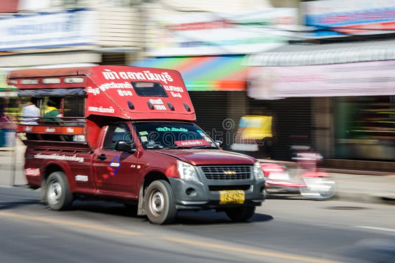 Moving Red Thai minibus. editorial stock image. Image of public - 66053839