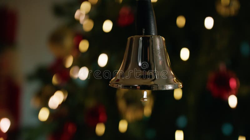Moving Ringing Bell Decoration in Front of Christmas Tree Stock Video ...