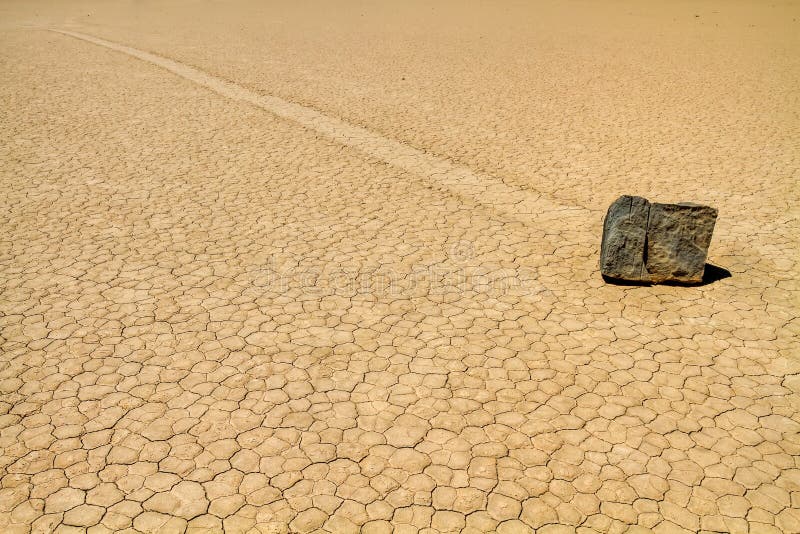Moving Rock On Cracked Desert Ground Royalty Free Stock Photos - Image ...