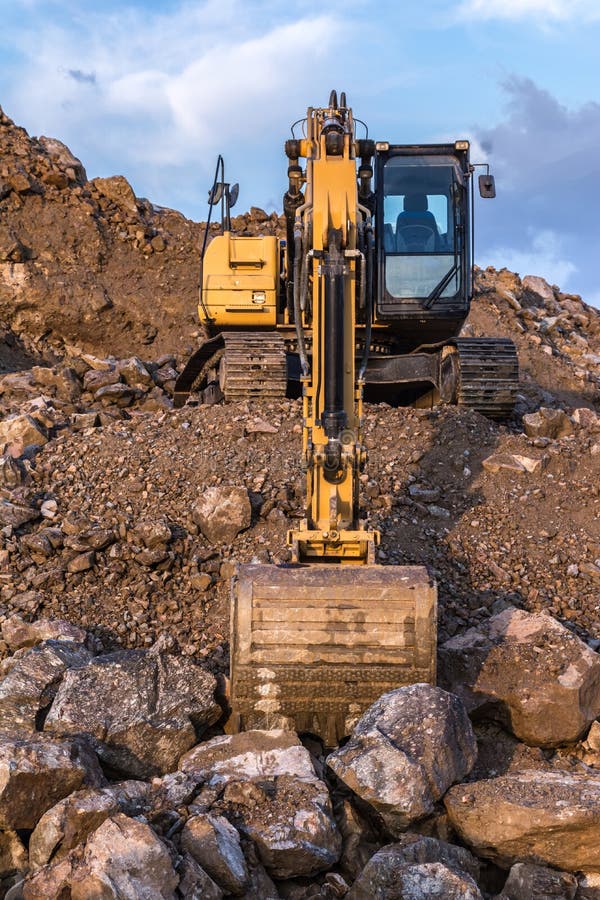 Moving Rock and Sand in a Construction Site. Stock Photo - Image of ...