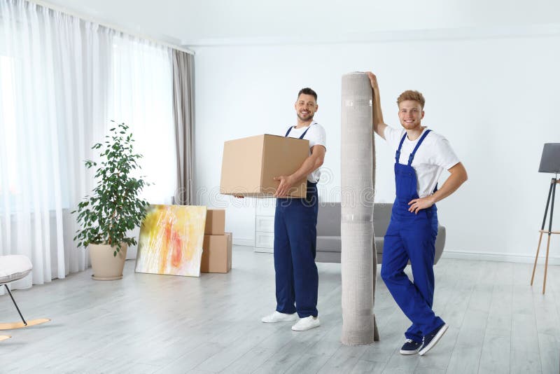 Moving Service Employees with Box and Carpet Stock Photo - Image of ...