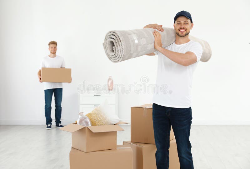 Moving Service Employees with Cardboard Boxes and Carpet Stock Image ...