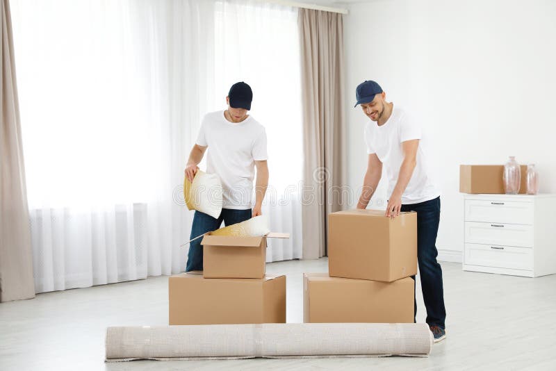 Moving Service Employees with Cardboard Boxes Stock Image - Image of ...