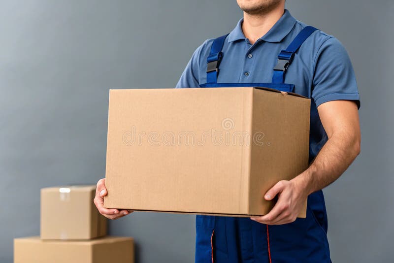 Moving Service Worker Holds Cardboard Box Close-up. Mover in Uniform ...