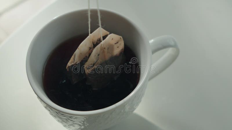 Moving Tea Bags in and Out of Beverage Stock Footage - Video of flavor ...