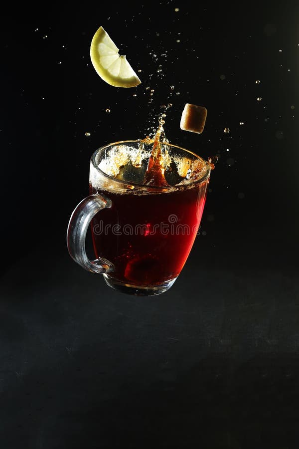 A Falling Tea Cup with Lemon and Sugar Stock Photo - Image of beverage ...