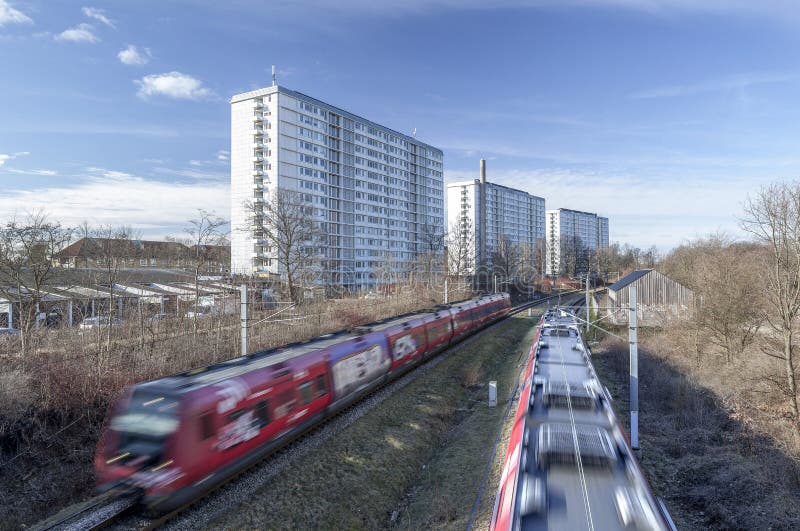 Moving Trains Crossing Three Big White Buildings Stock Photo - Image of ...