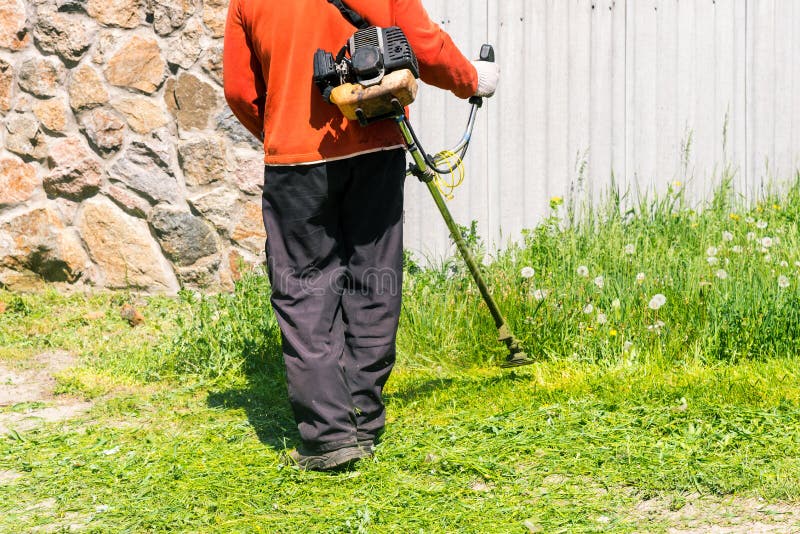 Mowing Grass by Hand Lawn Mower. Stock Photo - Image of farmer ...