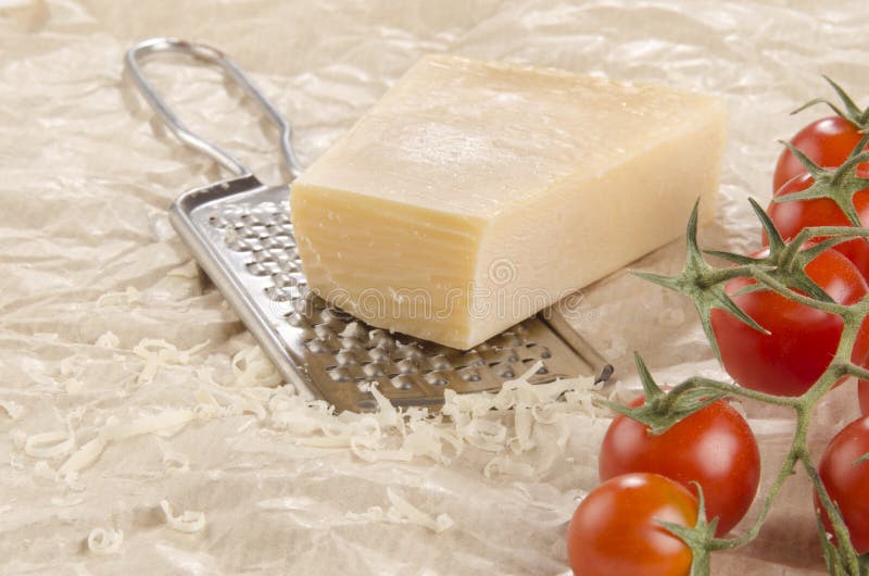 Mozarella and Grater on Paper Stock Photo - Image of cherry, grater ...