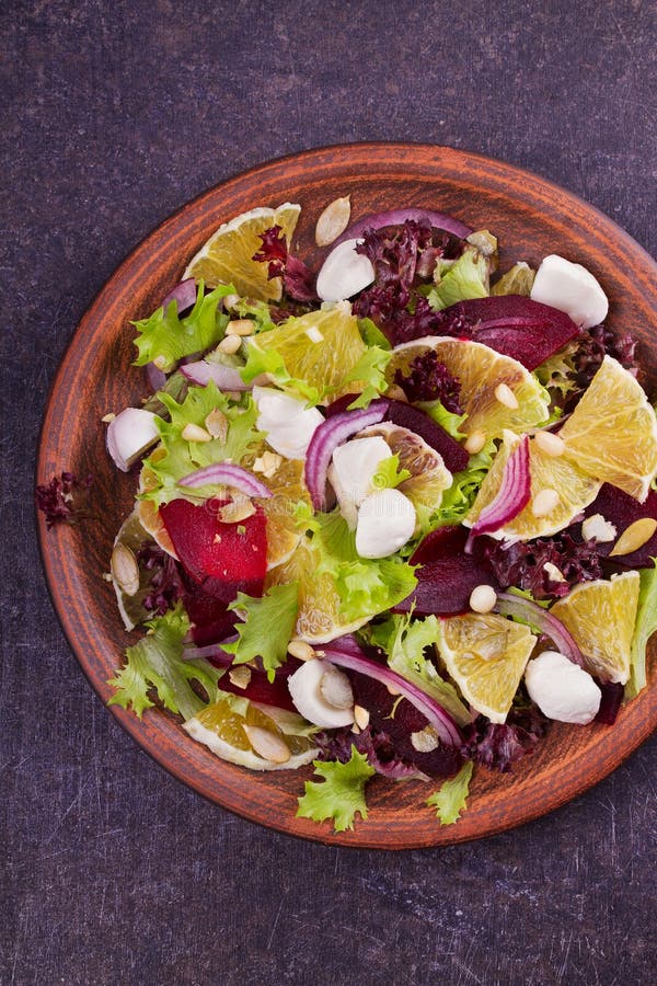 Mozzarella, Orange, Beetroot, Red Onion, Nuts and Seeds Salad. Stock ...