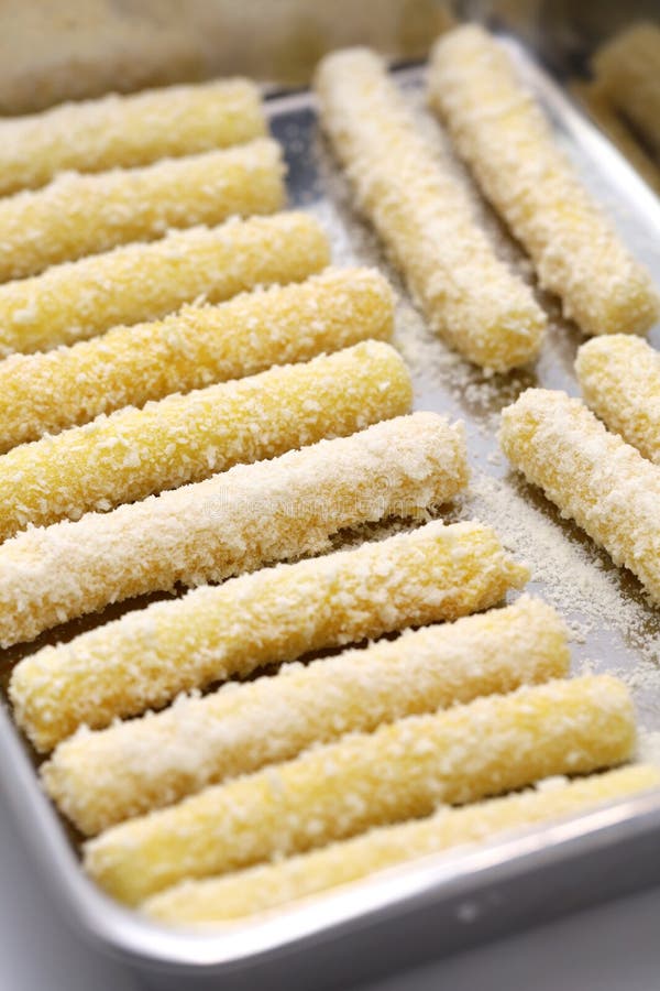 Mozzarella Sticks with Breaded Crumbs in Cooking Tray Stock Photo ...