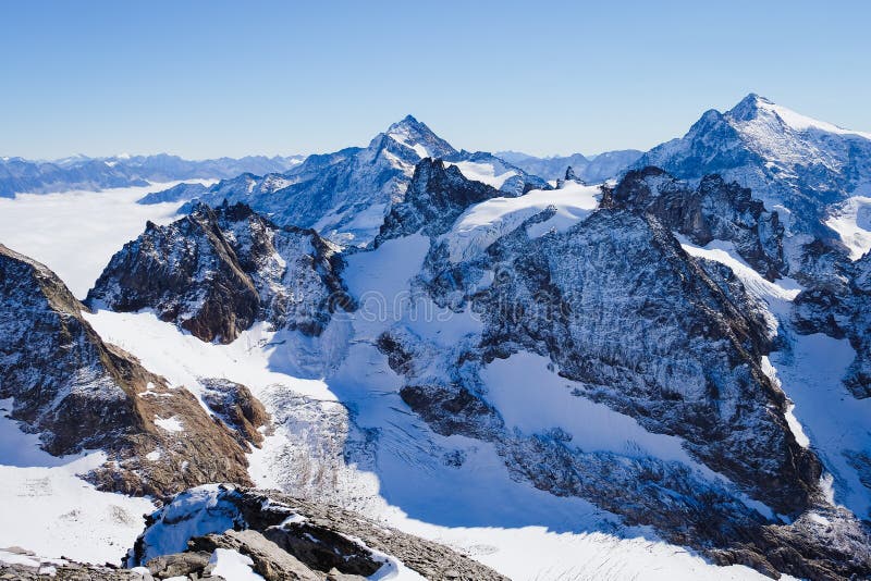 Standing on Titlis of the Swiss Alps Stock Image - Image of peaceful ...