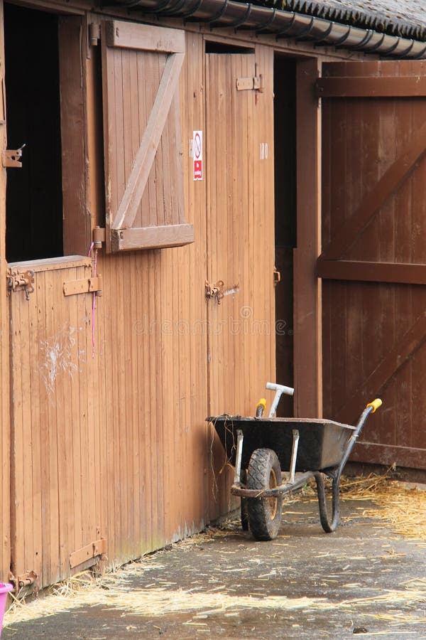 Mucking Out Wheelbarrow. stock photo. Image of outdoors - 160767758
