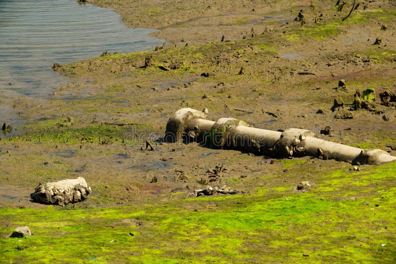 Mud and Drainage System Pipe To the River Stock Photo - Image of system ...