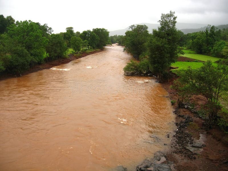 Muddy river in countryside stock image. Image of mountains - 3094685