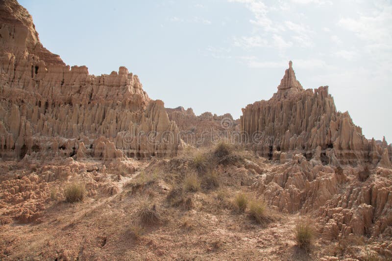 Mud hills and eroded land stock photo. Image of arch - 174591350