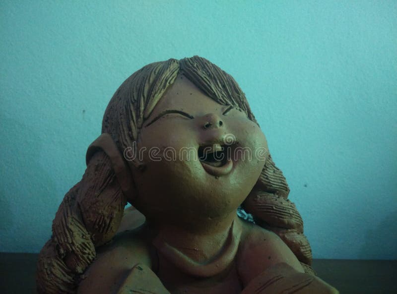 Mud kids wall art doll stock image. Image of mouth, cheek - 44413543