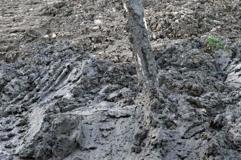 Mud and Mud in the Field As a Background with Cement Pillar at ...