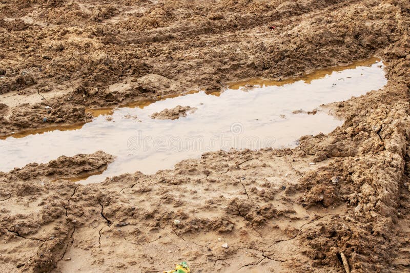 Mud and Puddle on a Sandy Road Stock Photo - Image of puddle ...