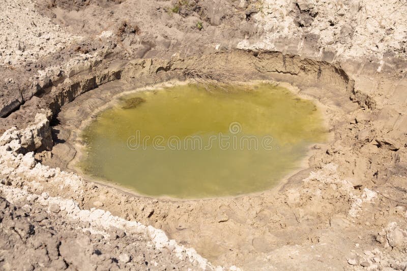 Mud puddles in sand stock photo. Image of messy, damp - 92414588