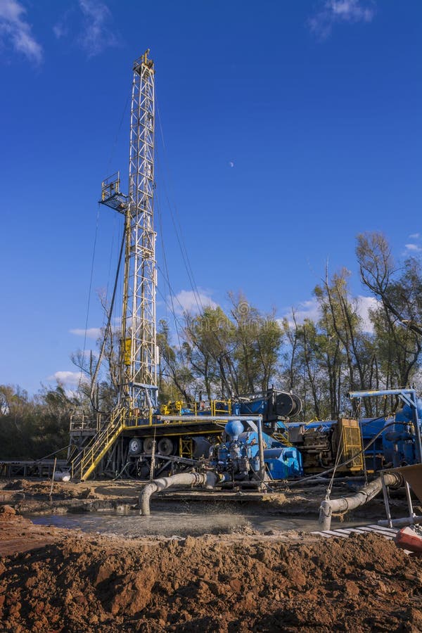 Mud Pumps in Front of Oil Drilling Rig Stock Image - Image of double ...