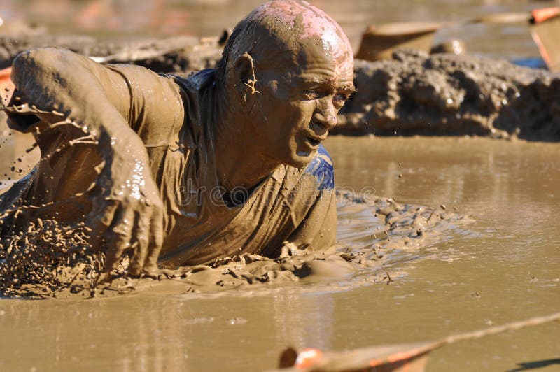 Mud Race editorial image. Image of covered, lifting, messy - 24550025