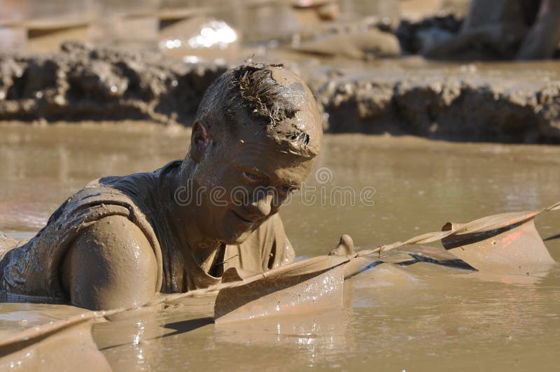 Mud Race editorial image. Image of covered, lifting, messy - 24550025