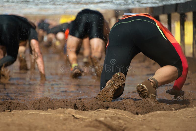 Mud race runners stock image. Image of barbed, marathon - 74815963