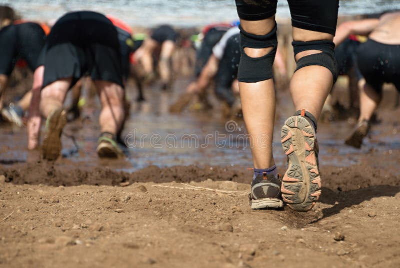 Running, Mud, and Obstacle Course Editorial Stock Image - Image of navy ...
