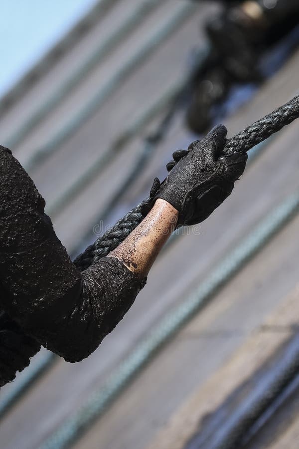 Mud Race Runners,defeating Obstacles by Using Rope Stock Image - Image ...