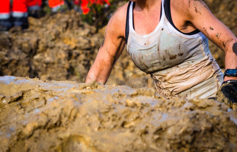 Mud Race Runners is Defeating a Obstacles by Using Ropes. Gijon ...