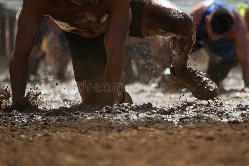 Mud race runners stock image. Image of muddy, outdoors - 74810985