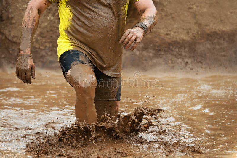 Mud race runners stock photo. Image of dirt, legs, water - 96419706